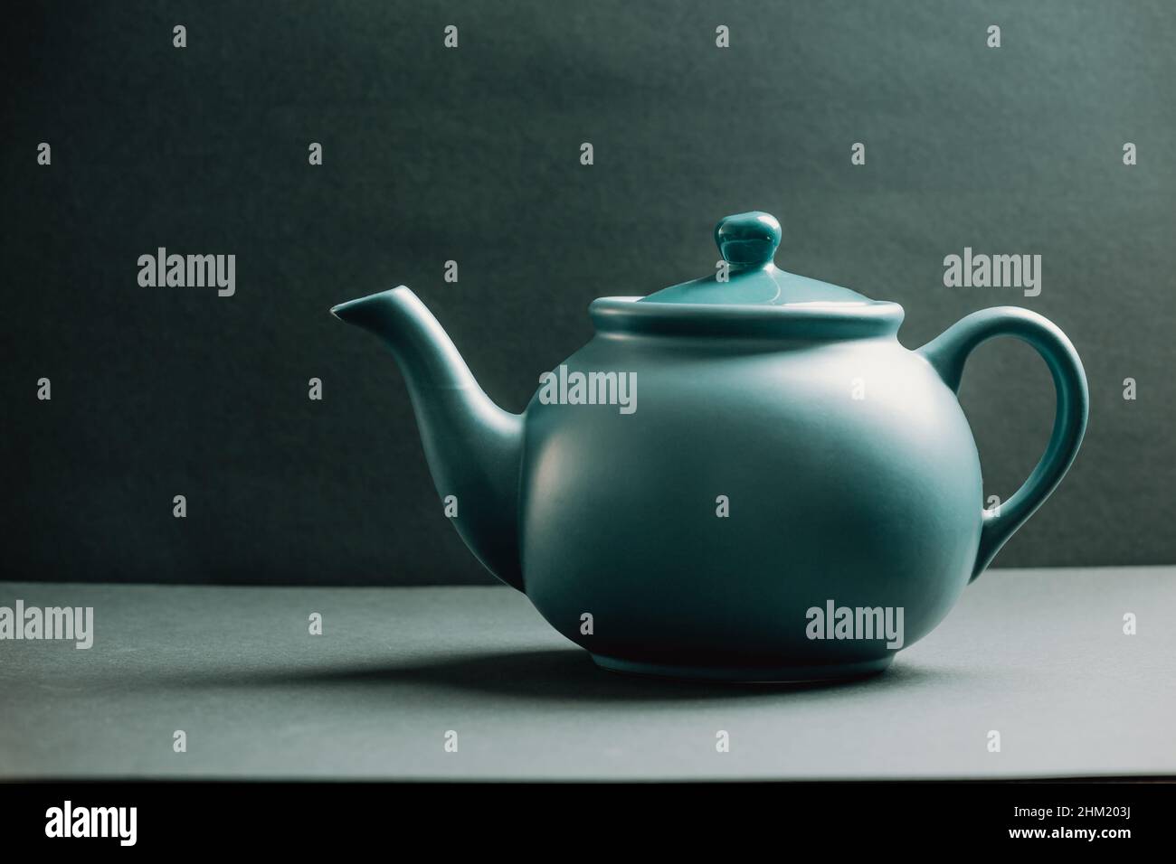 Blue teapot over dark hi-res stock photography and images - Alamy