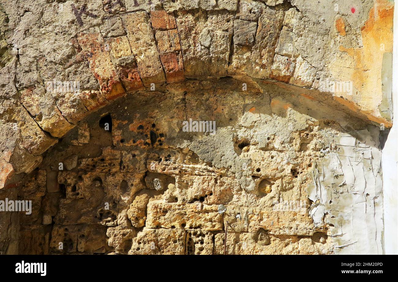 Entry and exit to the catacombs laid wall of natural stone Stock Photo ...