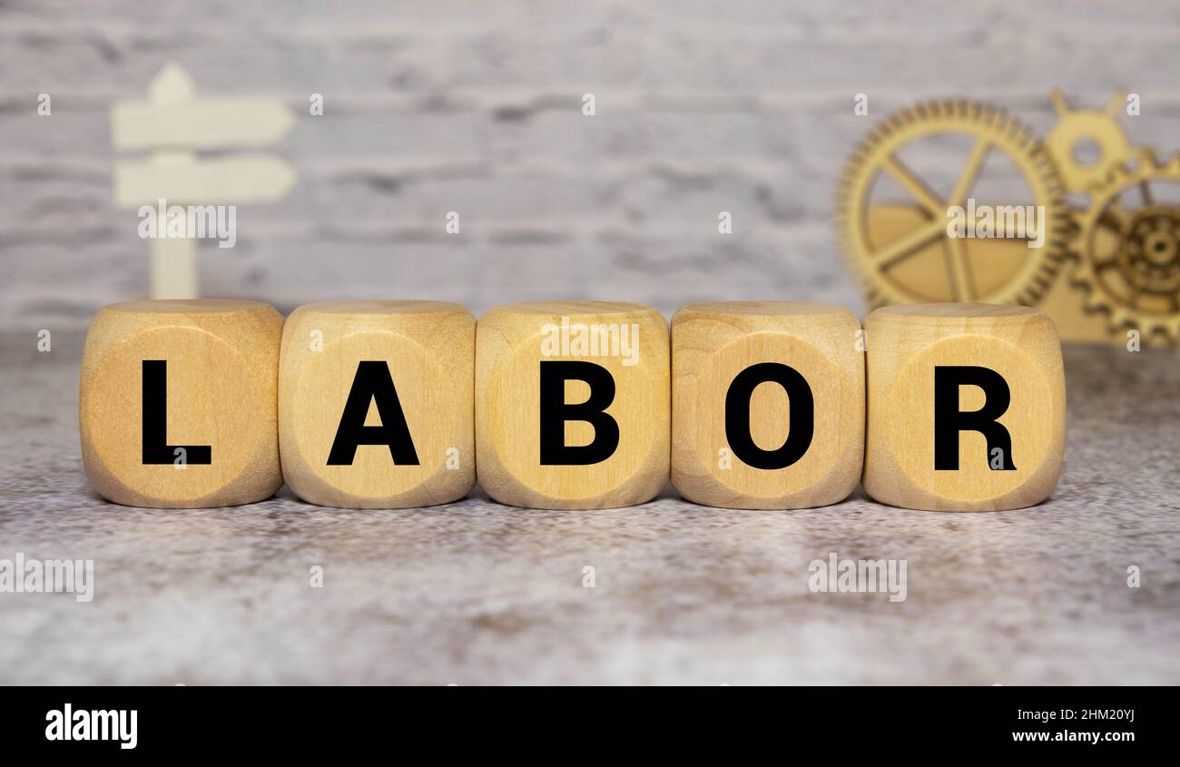 Alphabet letter block in word labor on wood background Stock Photo - Alamy