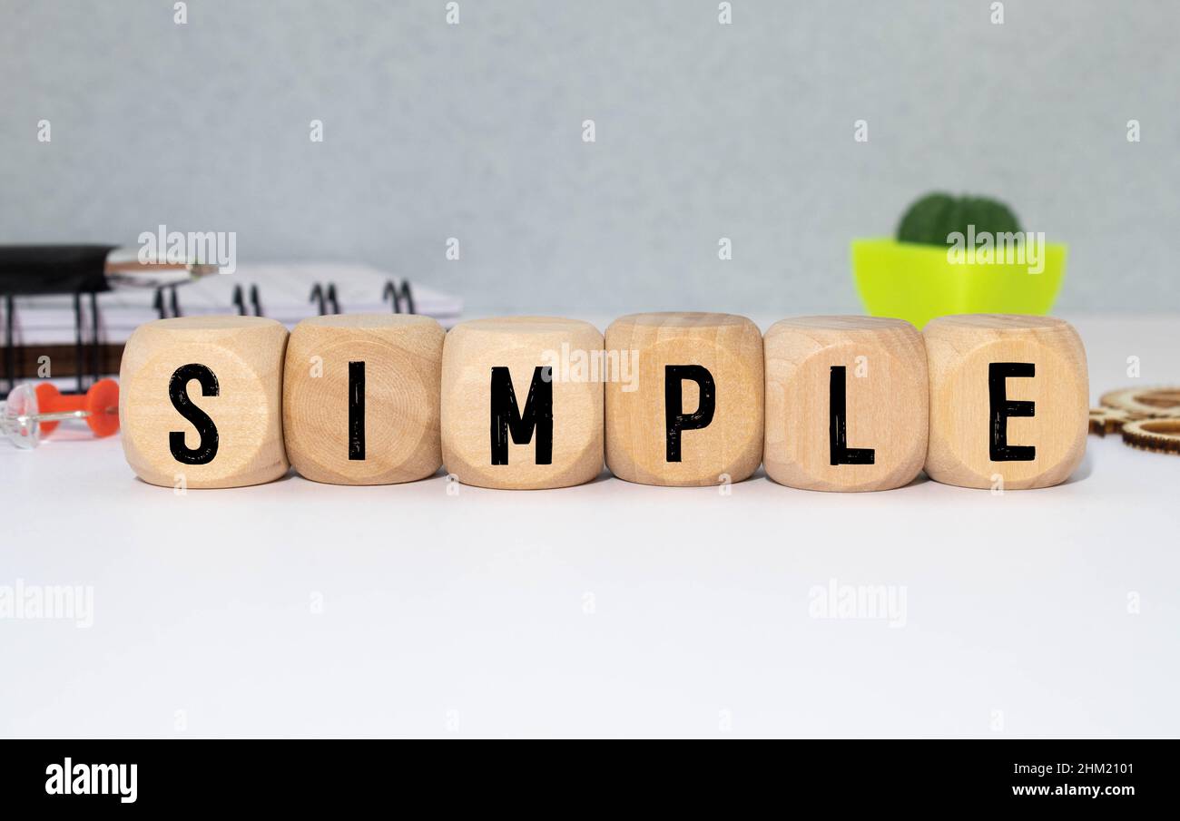 SIMPLE word made with building blocks isolated on white Stock Photo - Alamy