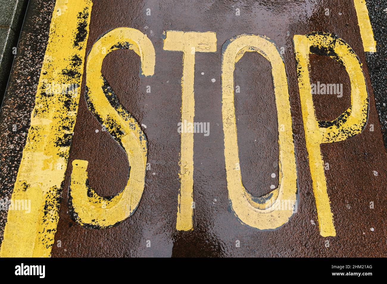 Vintage stop sign on city asphalt floor Stock Photo - Alamy