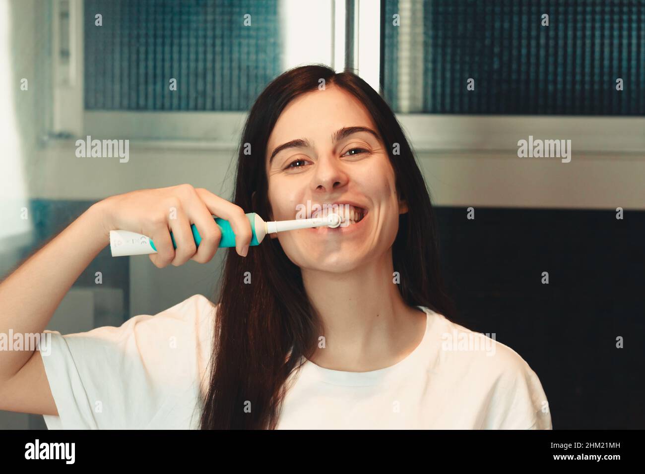 Woman washing face smiling camera hi-res stock photography and images ...