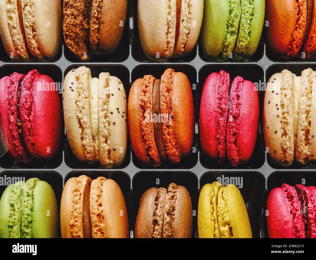 Colorful macarons in a row. Different colorful macaroons in Tasty sweet ...