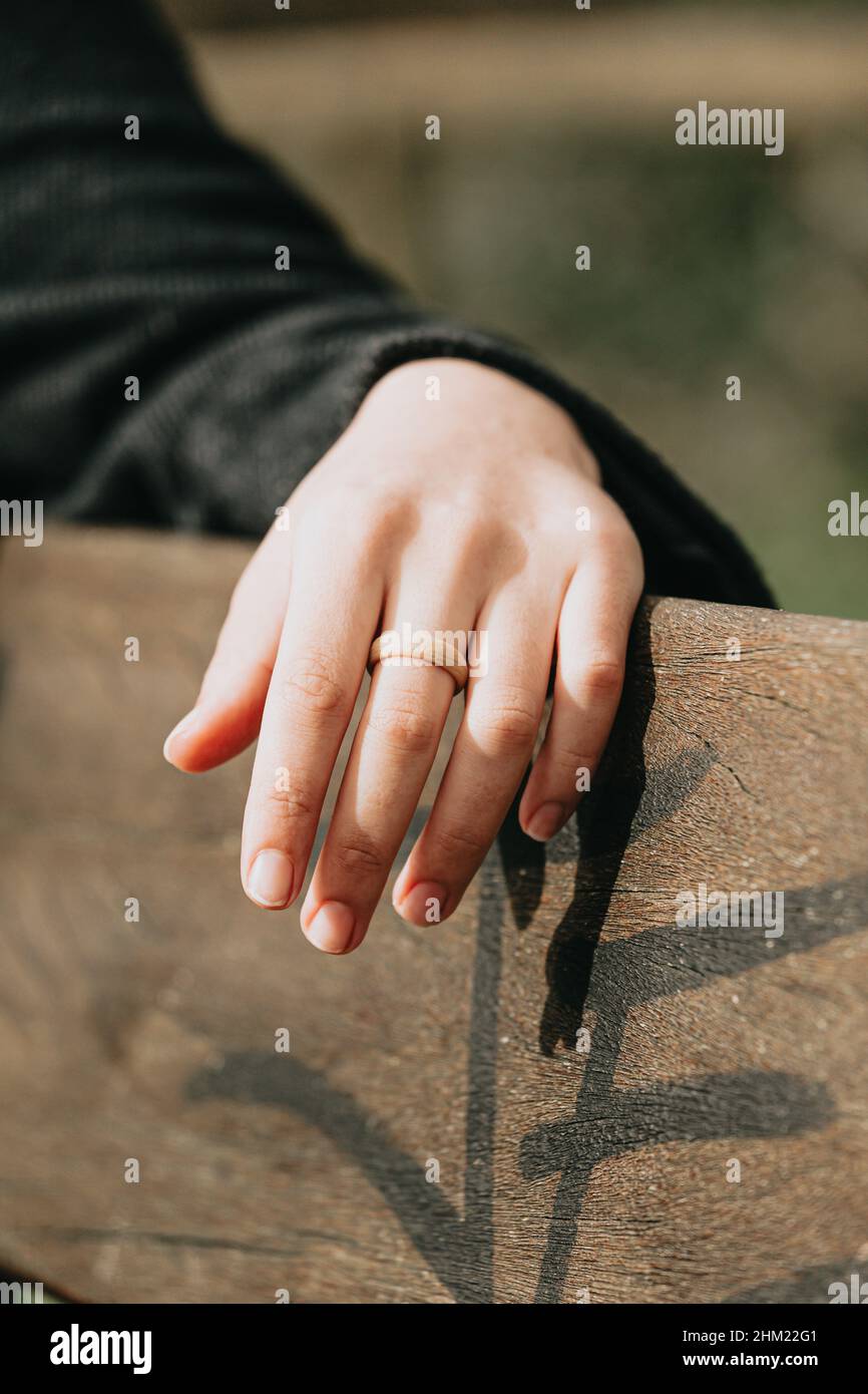 One hand with a rubber ring, marriage concept and freedom, modernity ...