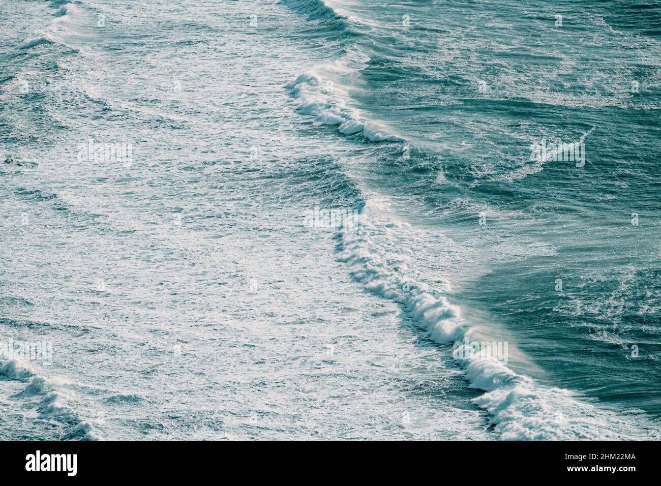 Aerial view of a massive wave crashing in the middle of the ocean Stock ...