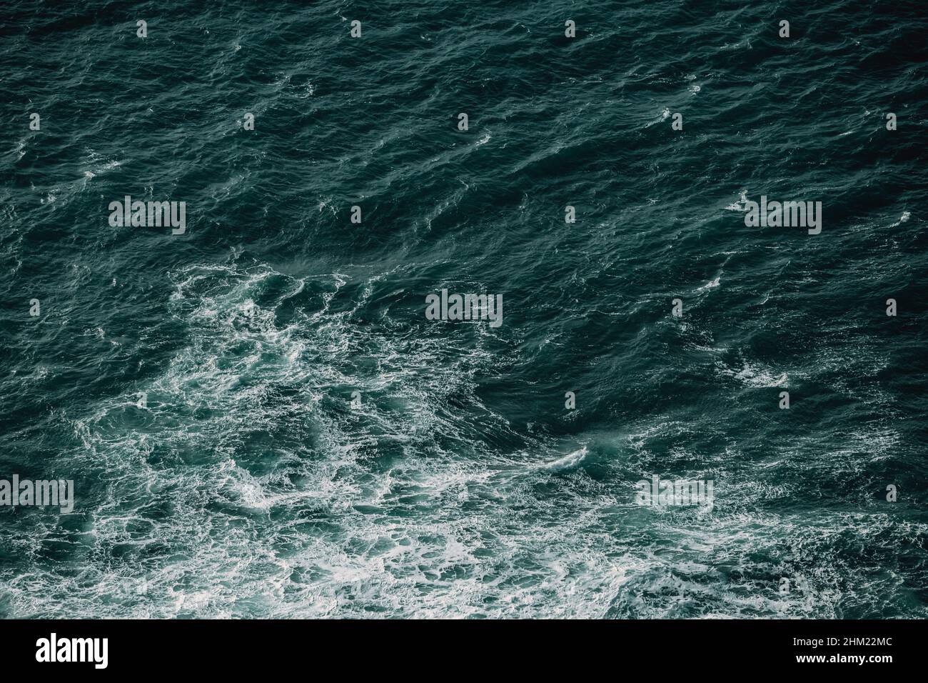 Aerial view of the ocean with some tides around Stock Photo - Alamy