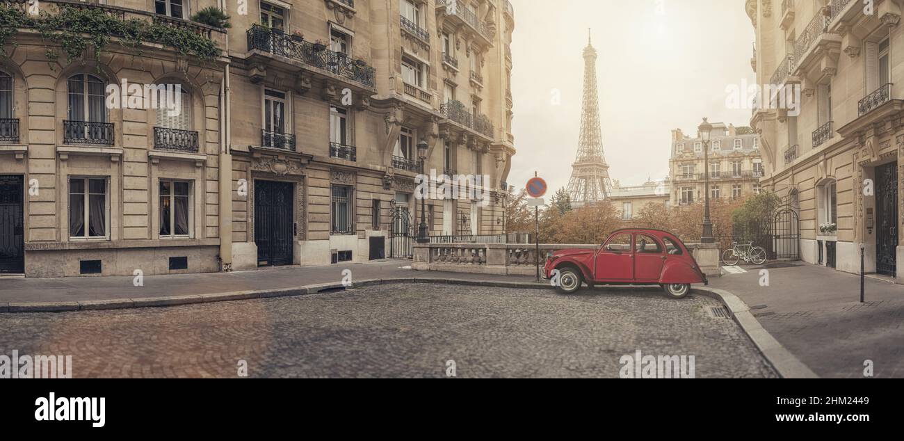 small street in paris with view on the famous eifel tower - panroama ...