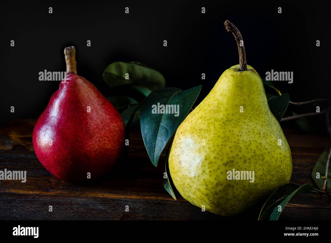 Normal view of a green or packham pear and a red or red battler pear on ...