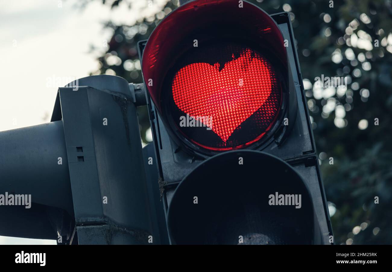 Traffic light with red heart shape in the city hi-res stock photography ...