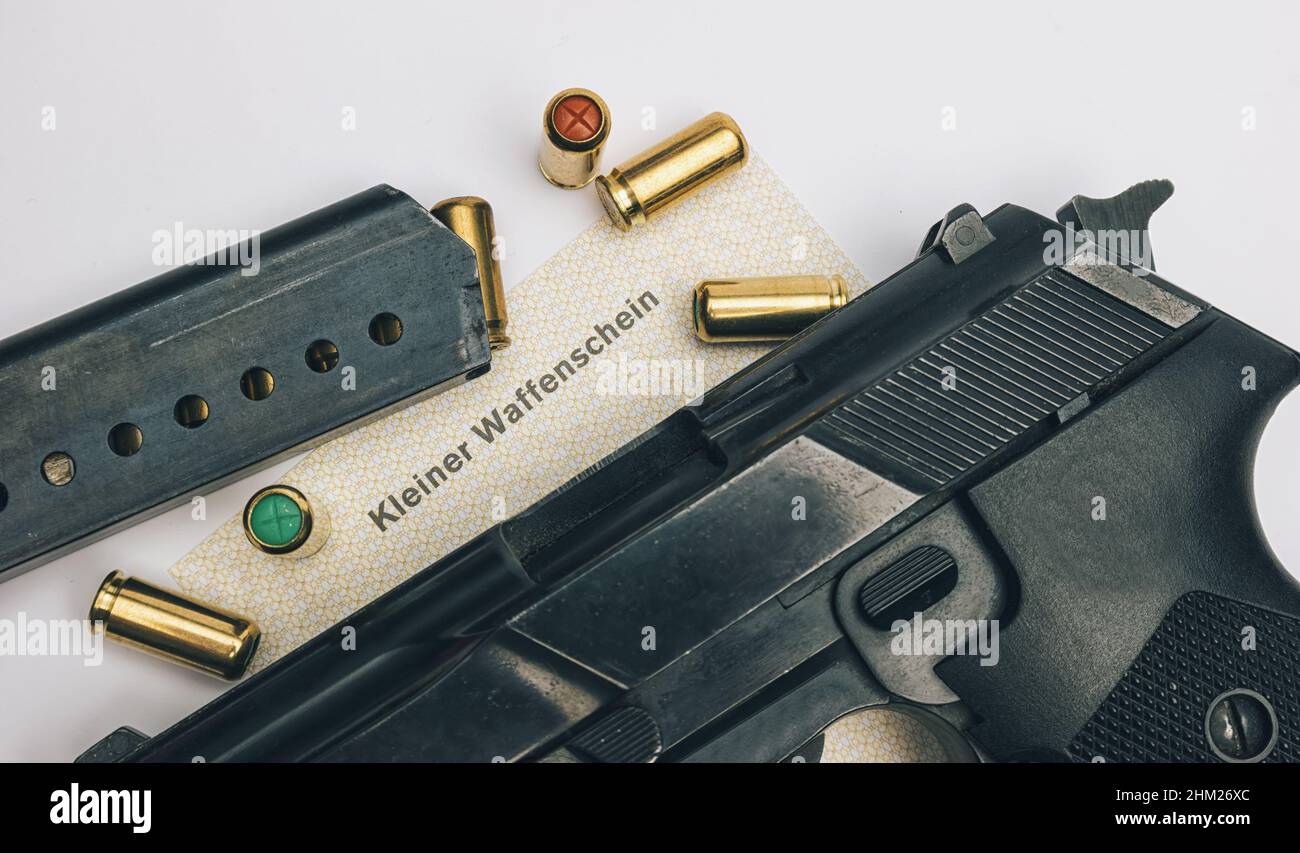 Gas pistol with cartridges Stock Photo - Alamy