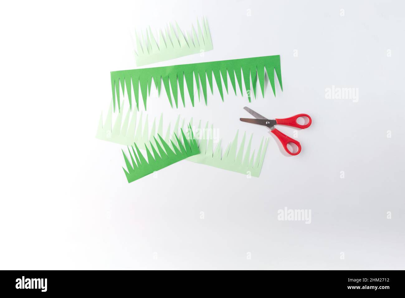 green paper grass craft, DIY instructions, recycling concept Stock ...