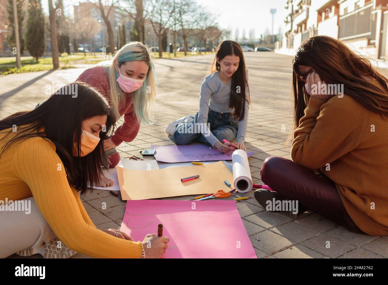 Multicultural group preparing together feminist movement womens ...