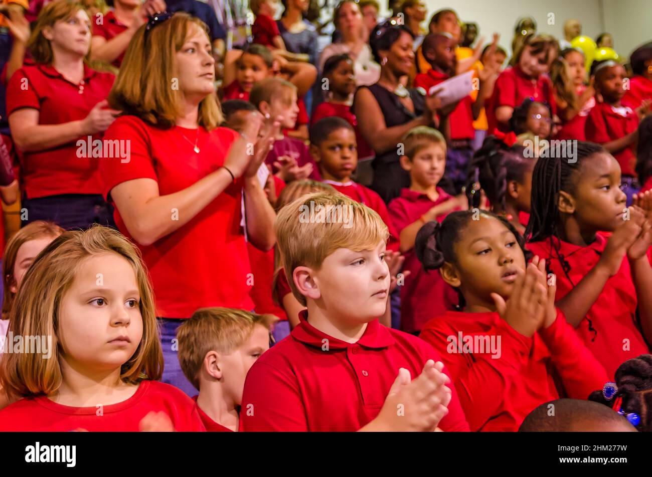 School children attend a send-off ceremony for members of the U.S. Army ...