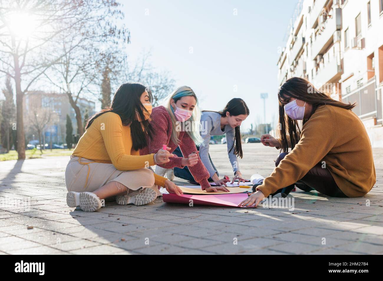 Multicultural group preparing together feminist movement womens ...