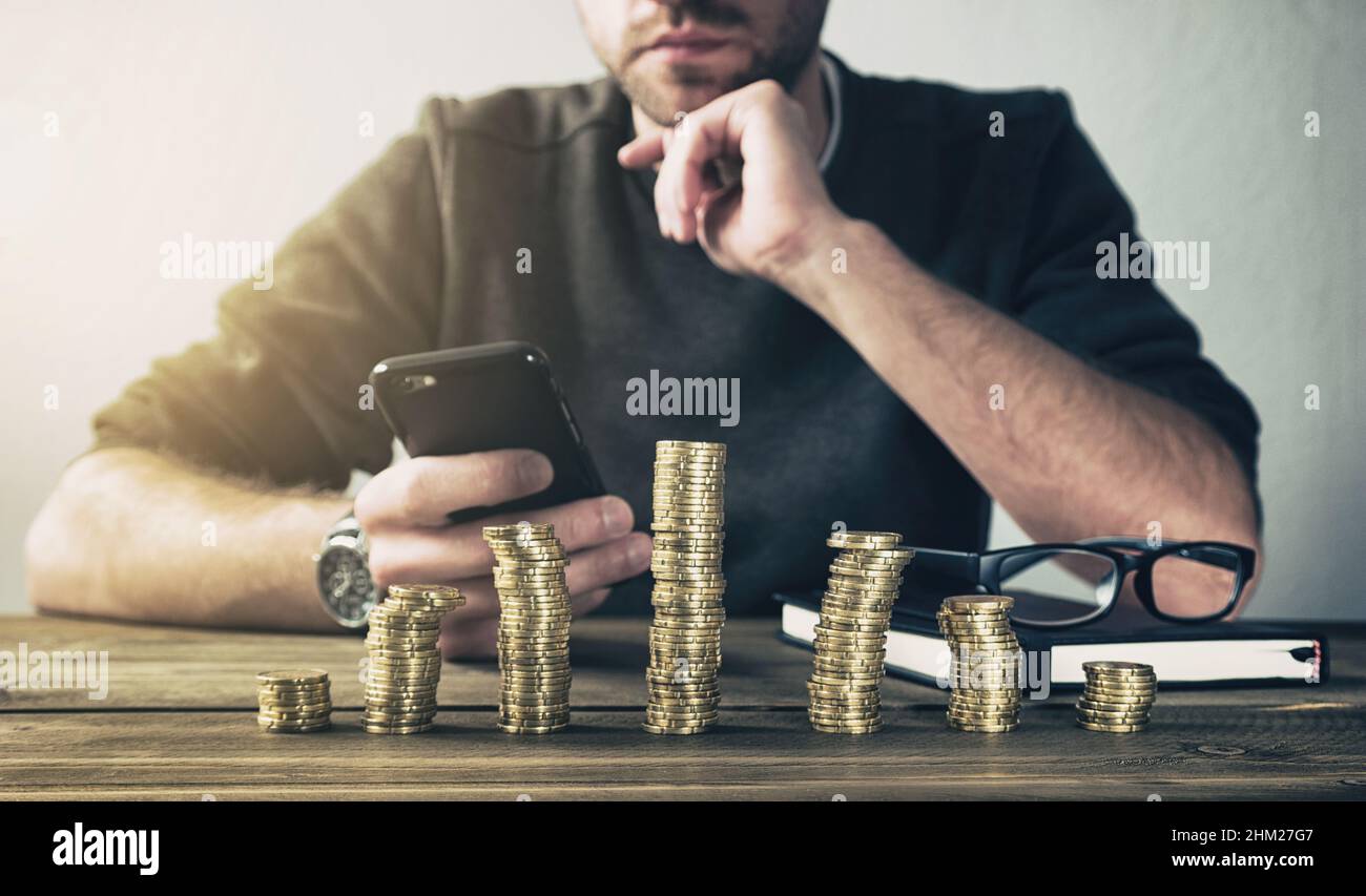 Calculating Finance with smartphone Stock Photo - Alamy