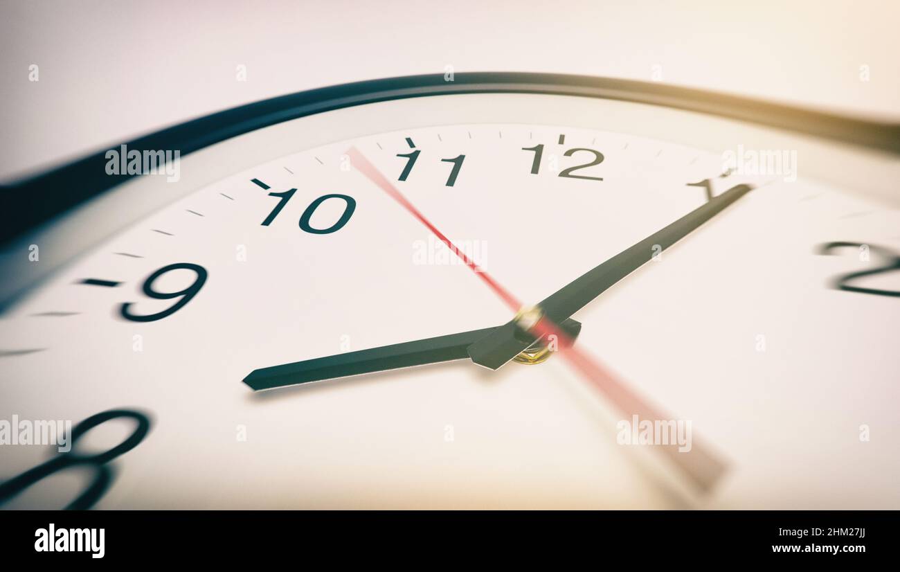 Round office clock in motion Stock Photo - Alamy
