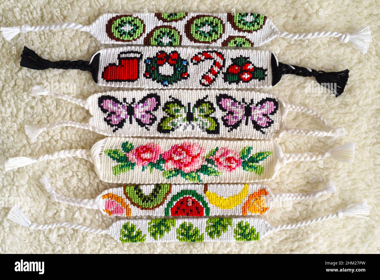 Woven DIY friendship bracelets handmade of embroidery thread with knots ...