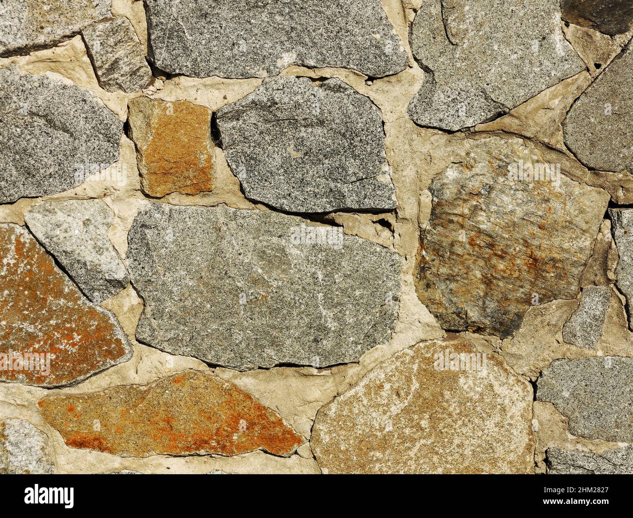Abstract background of the old wall of black natural stone with cracks ...