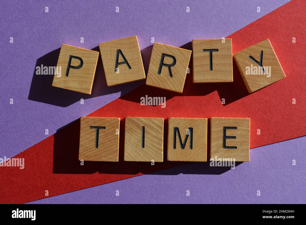 Party Time, words in wooden alphabet letters isolated on bright and ...