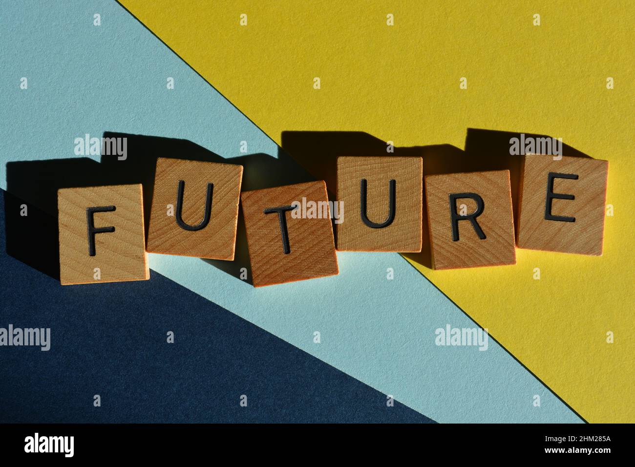 Future, word in wooden alphabet letters isolated on blue and yellow ...