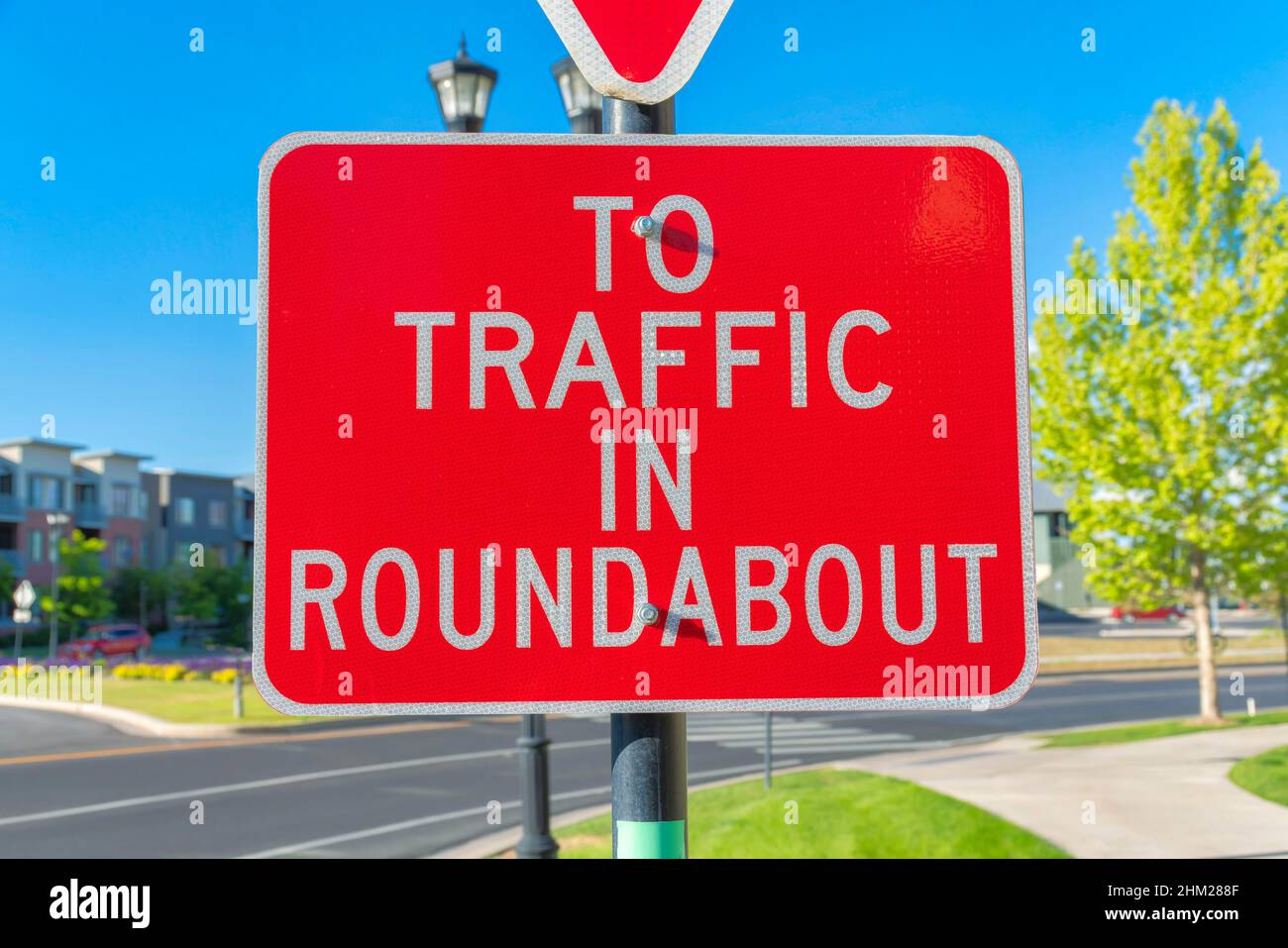 Red roadsign with white To traffic in roundabout at Daybreak in South ...