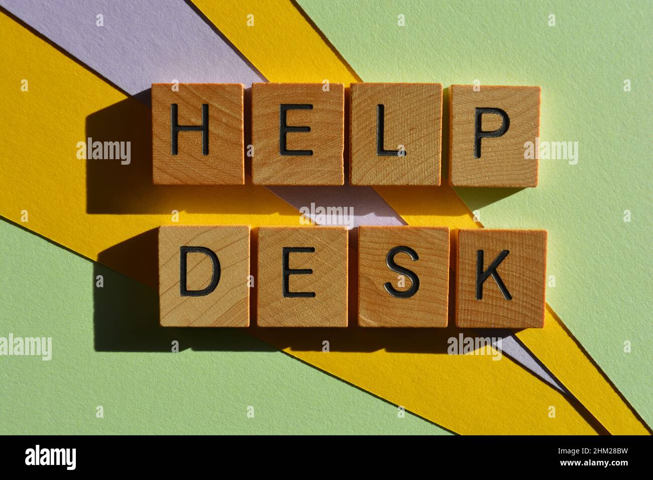Help Desk, words in wooden alphabet letters isolated on multicoloured ...