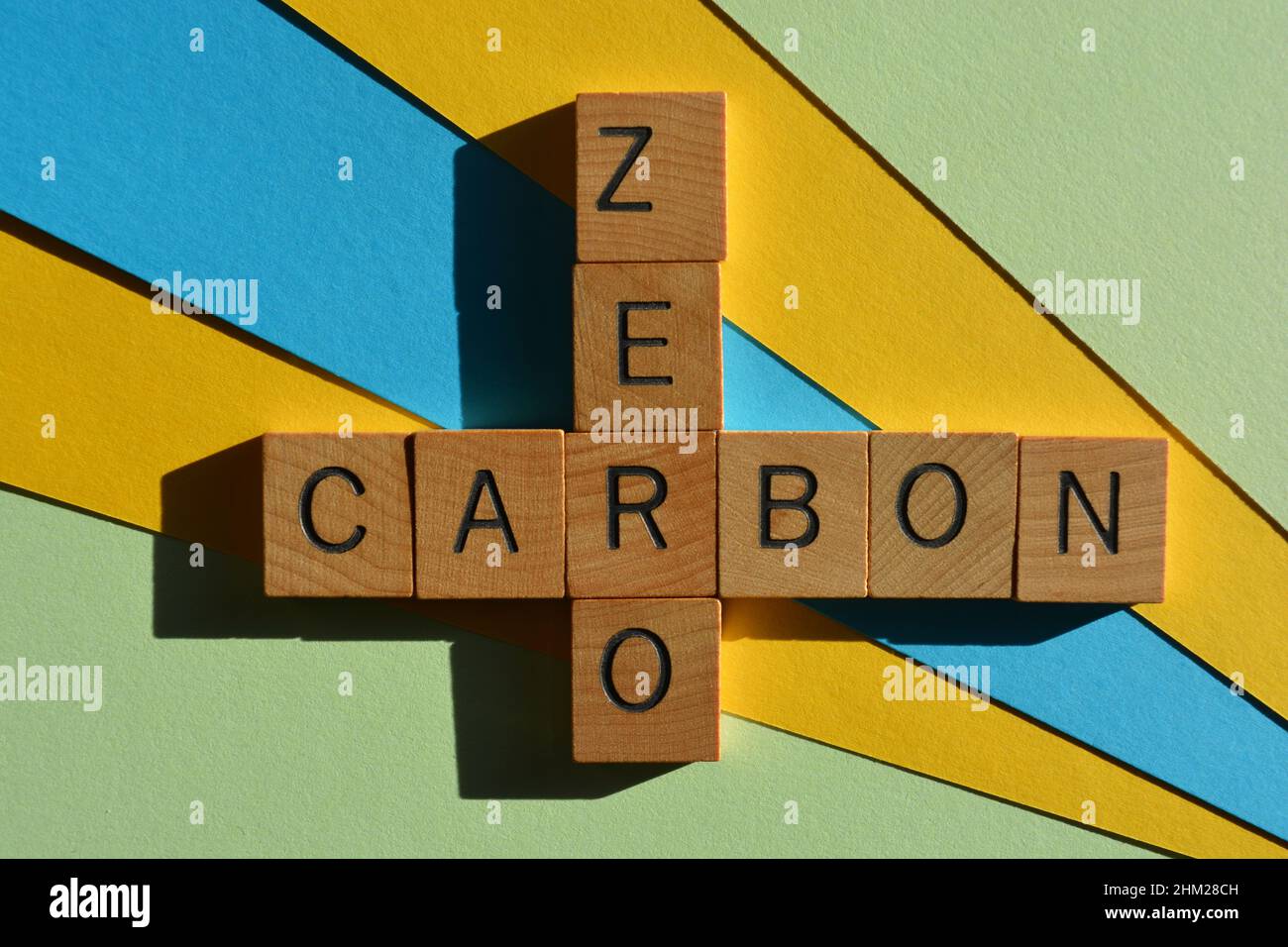 Zero, Carbon, words in wooden alphabet letters isolated on yellow, blue ...
