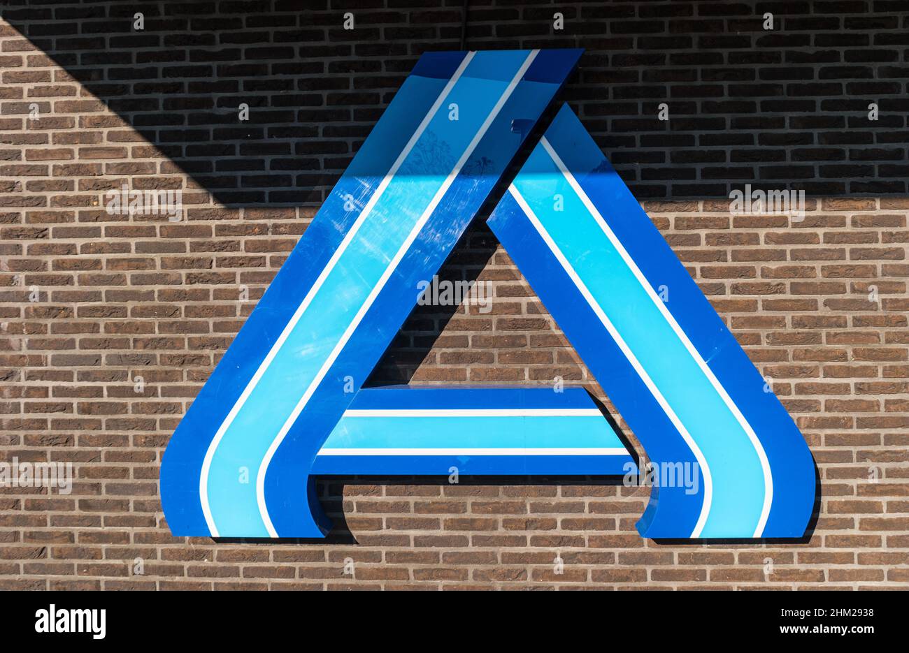 Aldi sign (north division) on a brick wall. Aldi is a leading global ...
