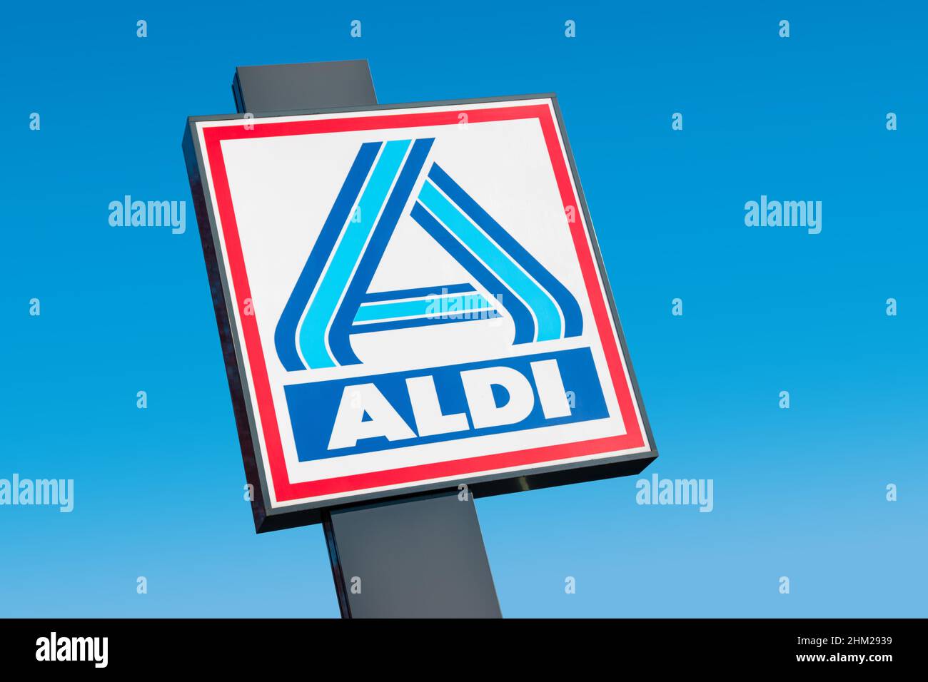 Aldi sign (north division) against blue sky. Aldi is a leading global ...