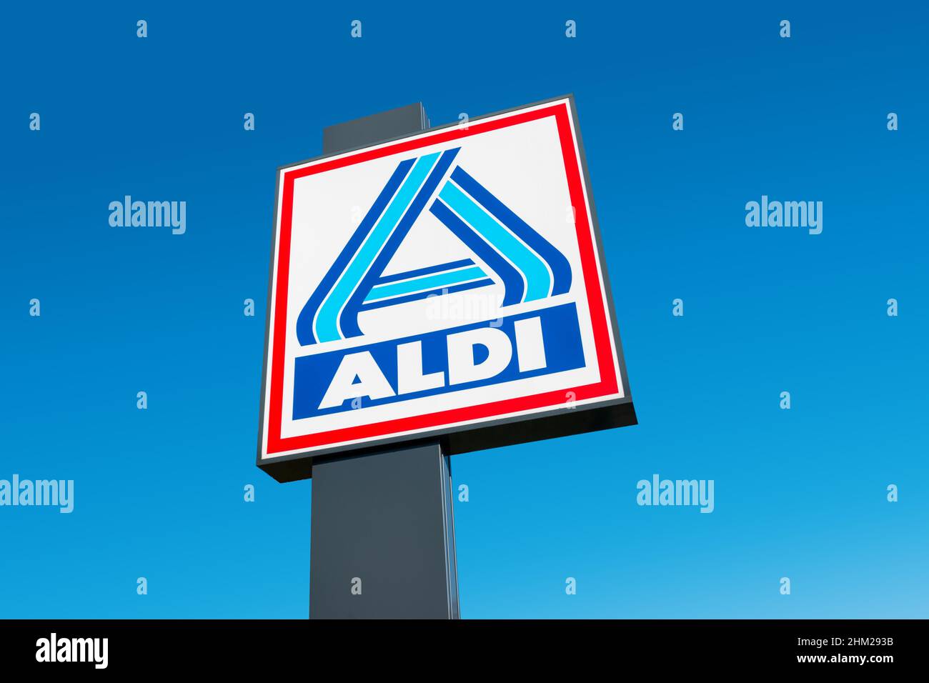 Aldi sign (north division) against blue sky. Aldi is a leading global ...