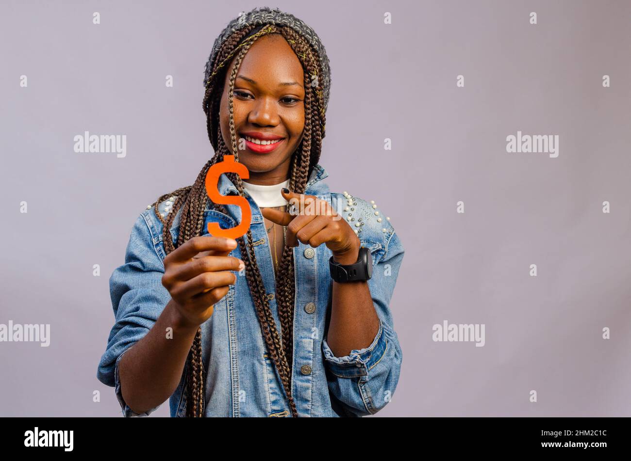Surprised african lady holding hi-res stock photography and images - Alamy
