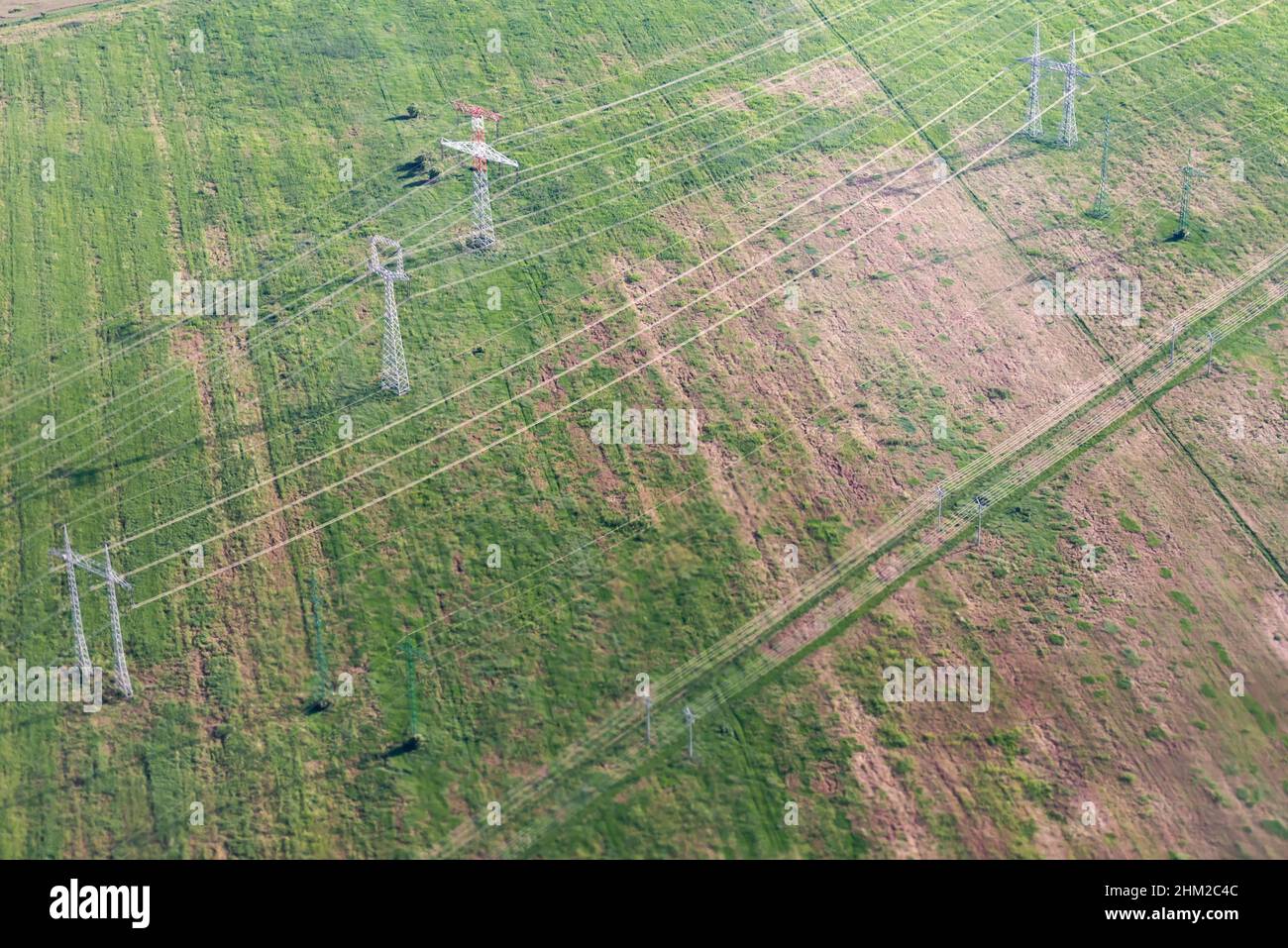 Green fields with a power line. Spring European fields taken from an ...