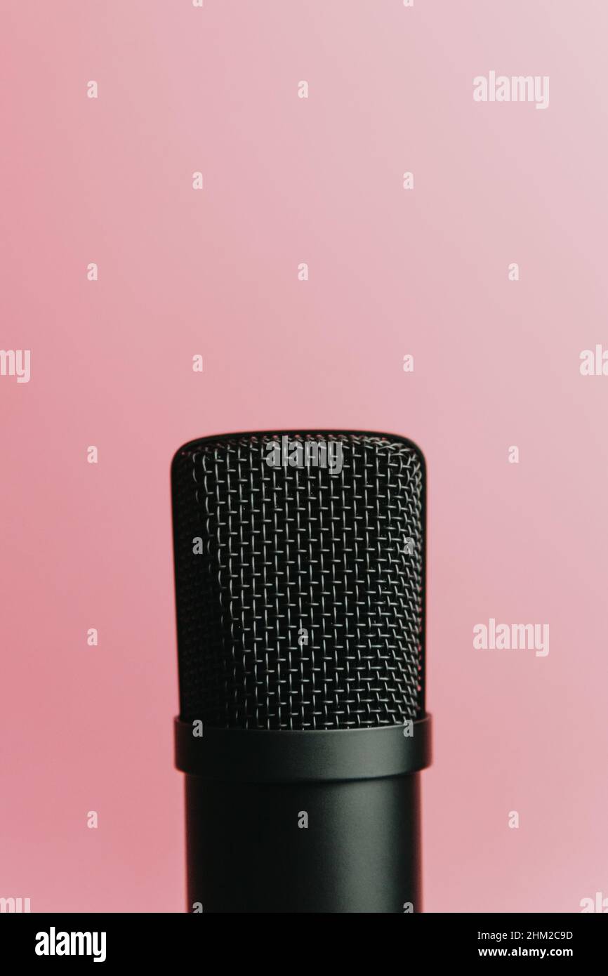 Minimalistic image of a streaming microphone over an pastel pink ...