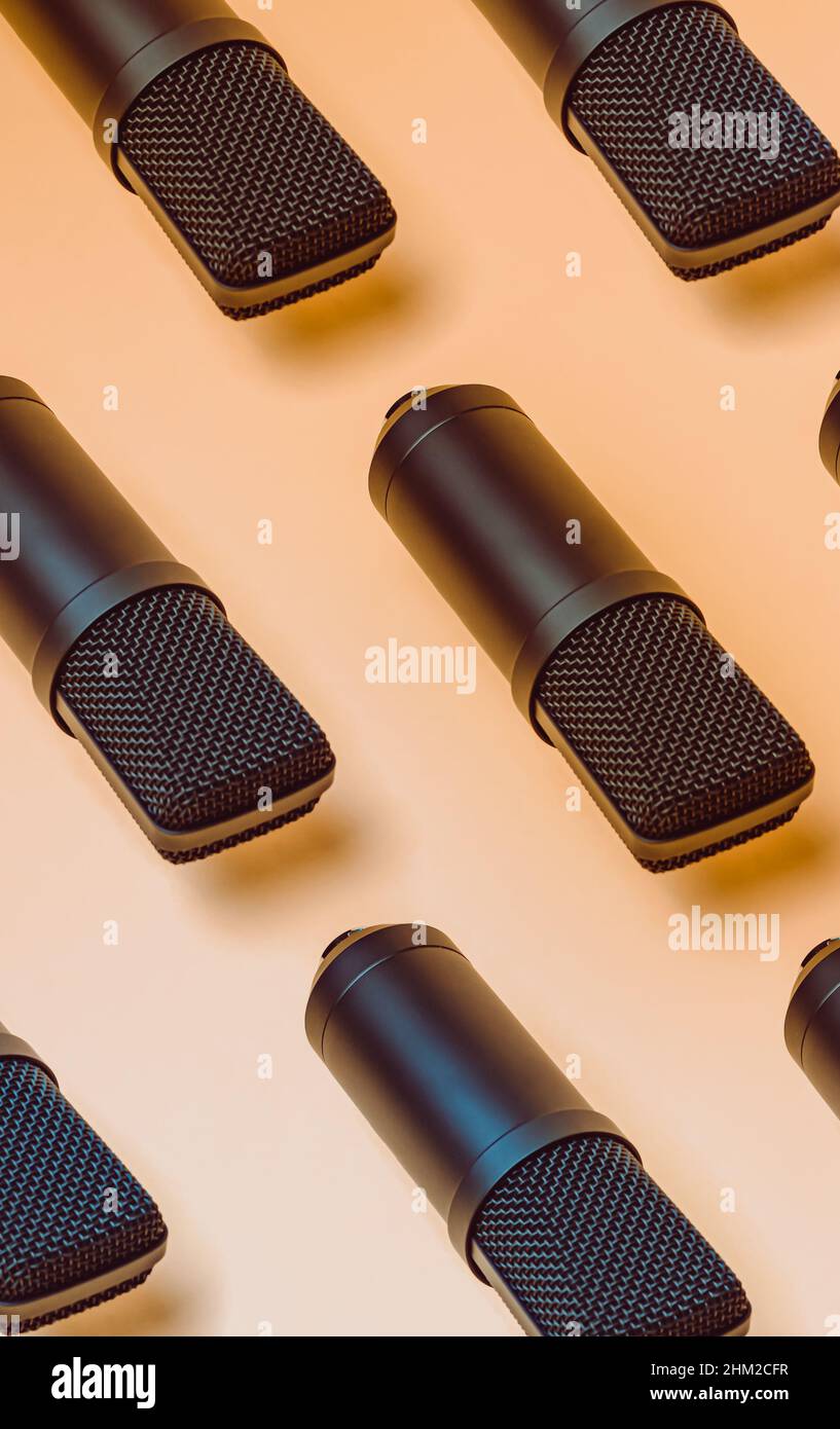 Mock up design of floating streaming mics microphones over a orange ...