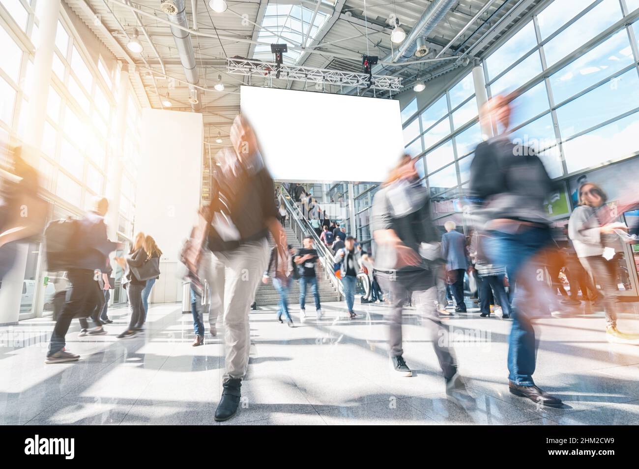 large crowd of anonymous blurred people rushing in a modern hall Stock ...
