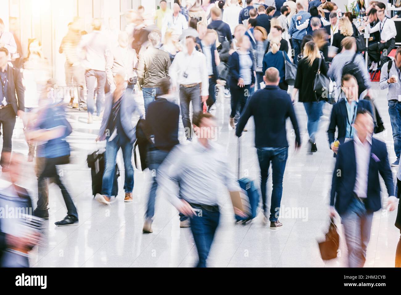 Large crowd of Blurred people at a trade fair floor Stock Photo - Alamy