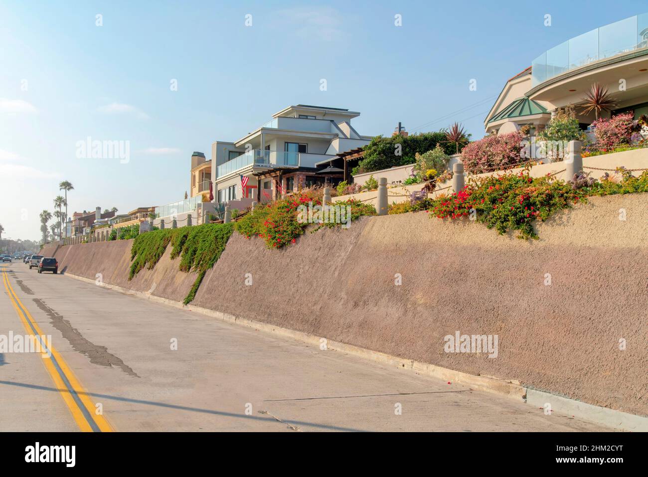 Pavement road with vehicles and double yellow lanes at Oceanside ...