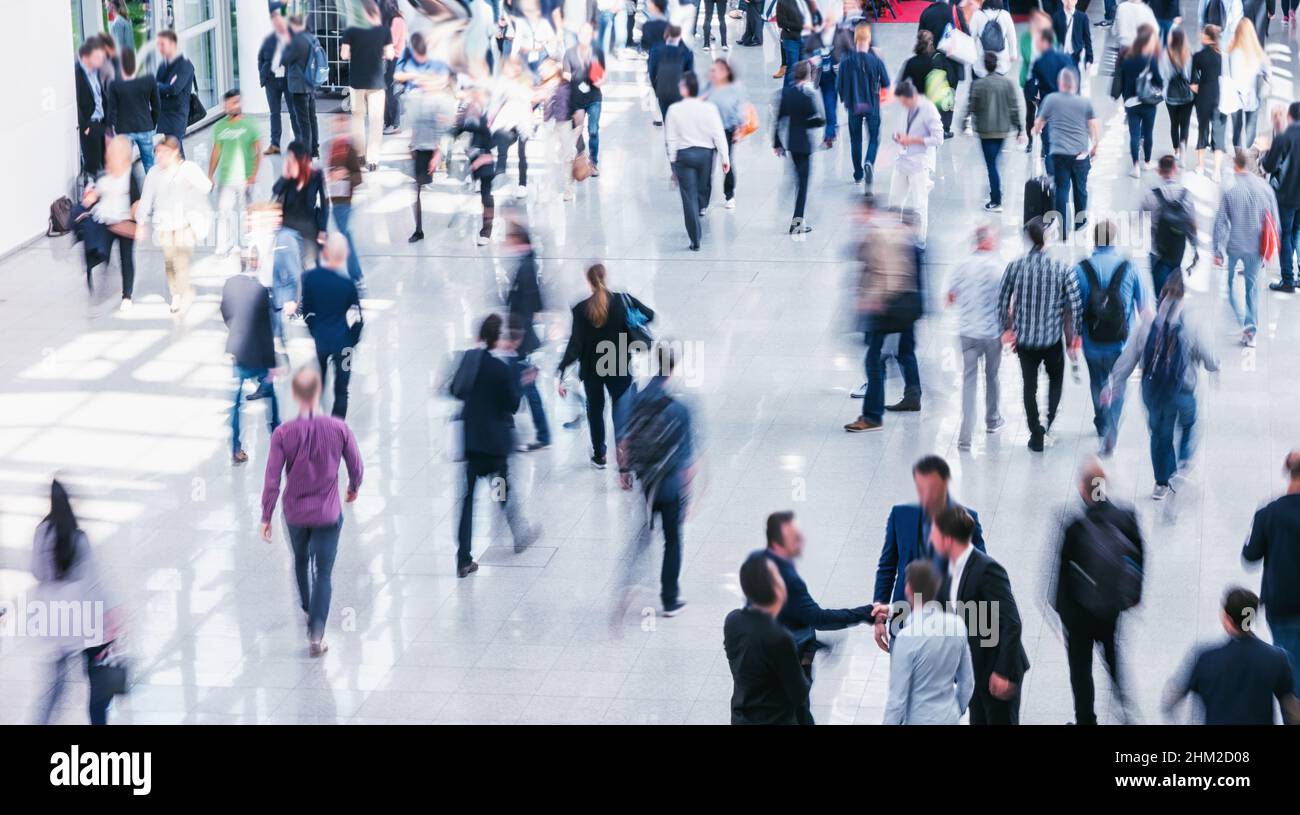 crowd of Blurred business people rushing Stock Photo - Alamy
