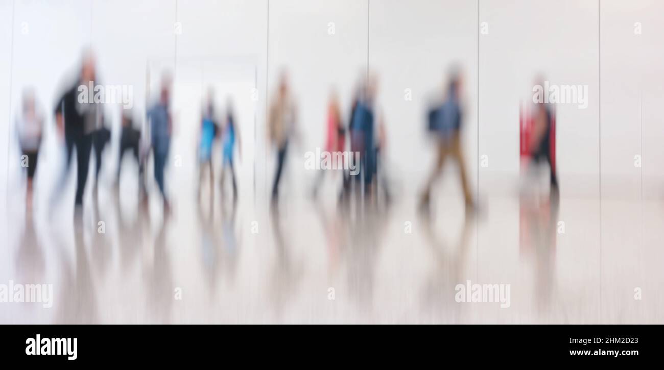 Intentionally blurred people walking background Stock Photo - Alamy