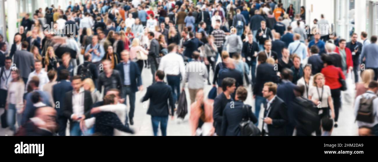 Anonymous crowd of people walking in a hall Stock Photo - Alamy