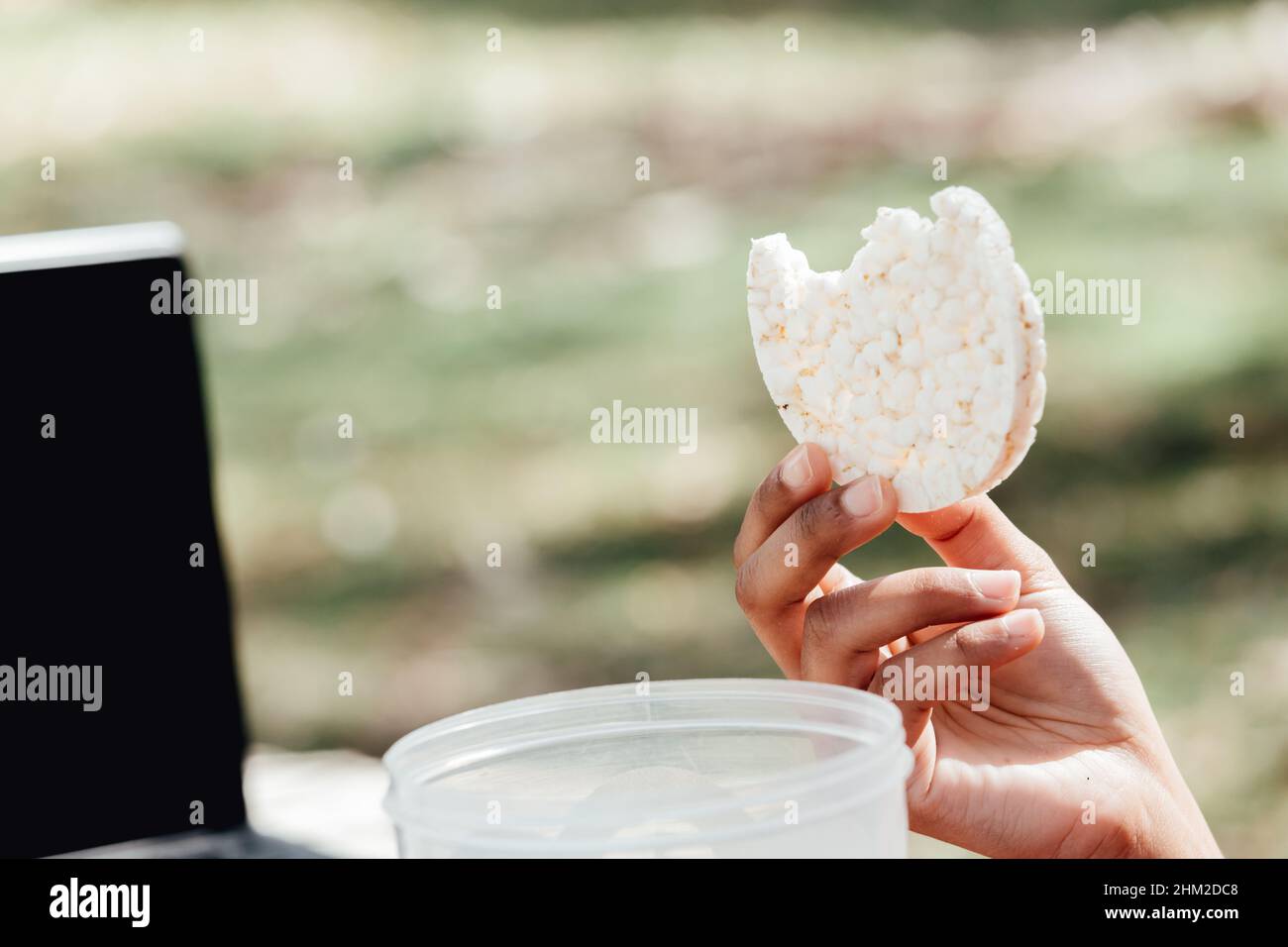 A hand grabbing a healthy food in the park Stock Photo - Alamy