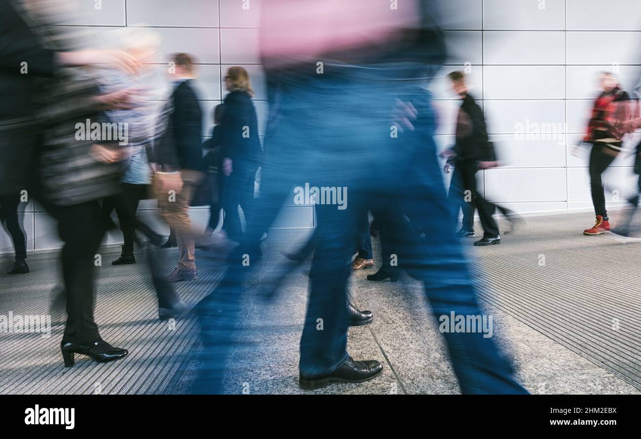 Blurred people rushing in a corridor Stock Photo - Alamy