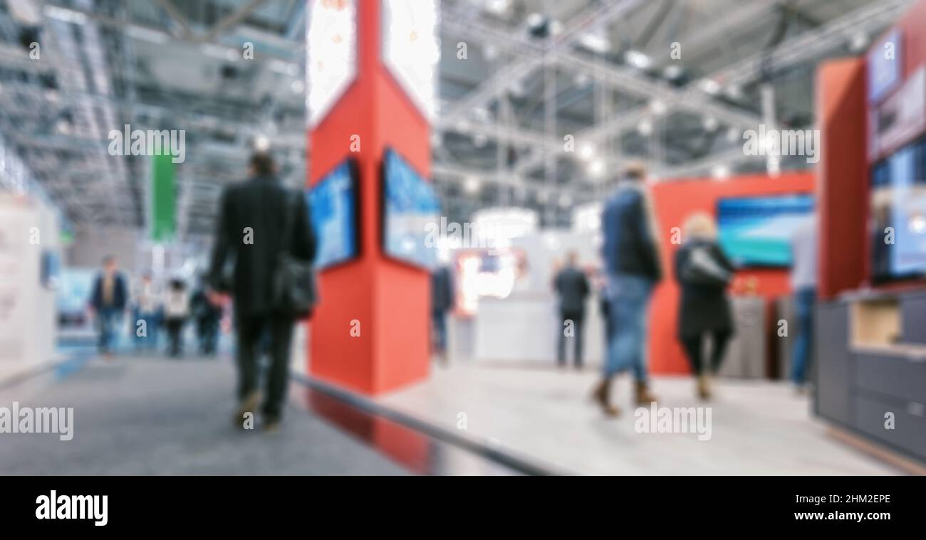 Intentionally blurred Trade fair Visitors background Stock Photo - Alamy