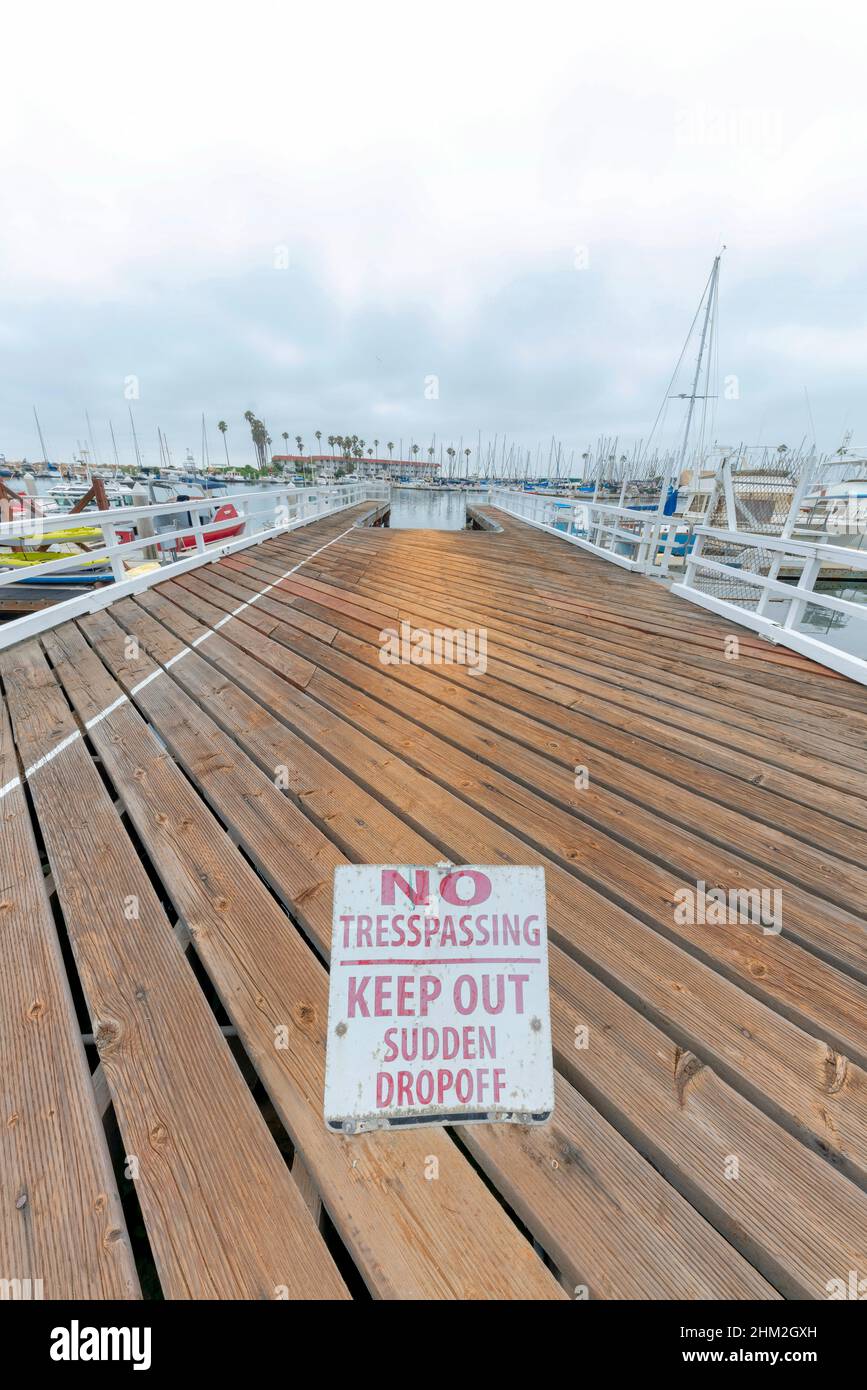 Signage on a wood planks flooring of a dock at Oceanside, California ...