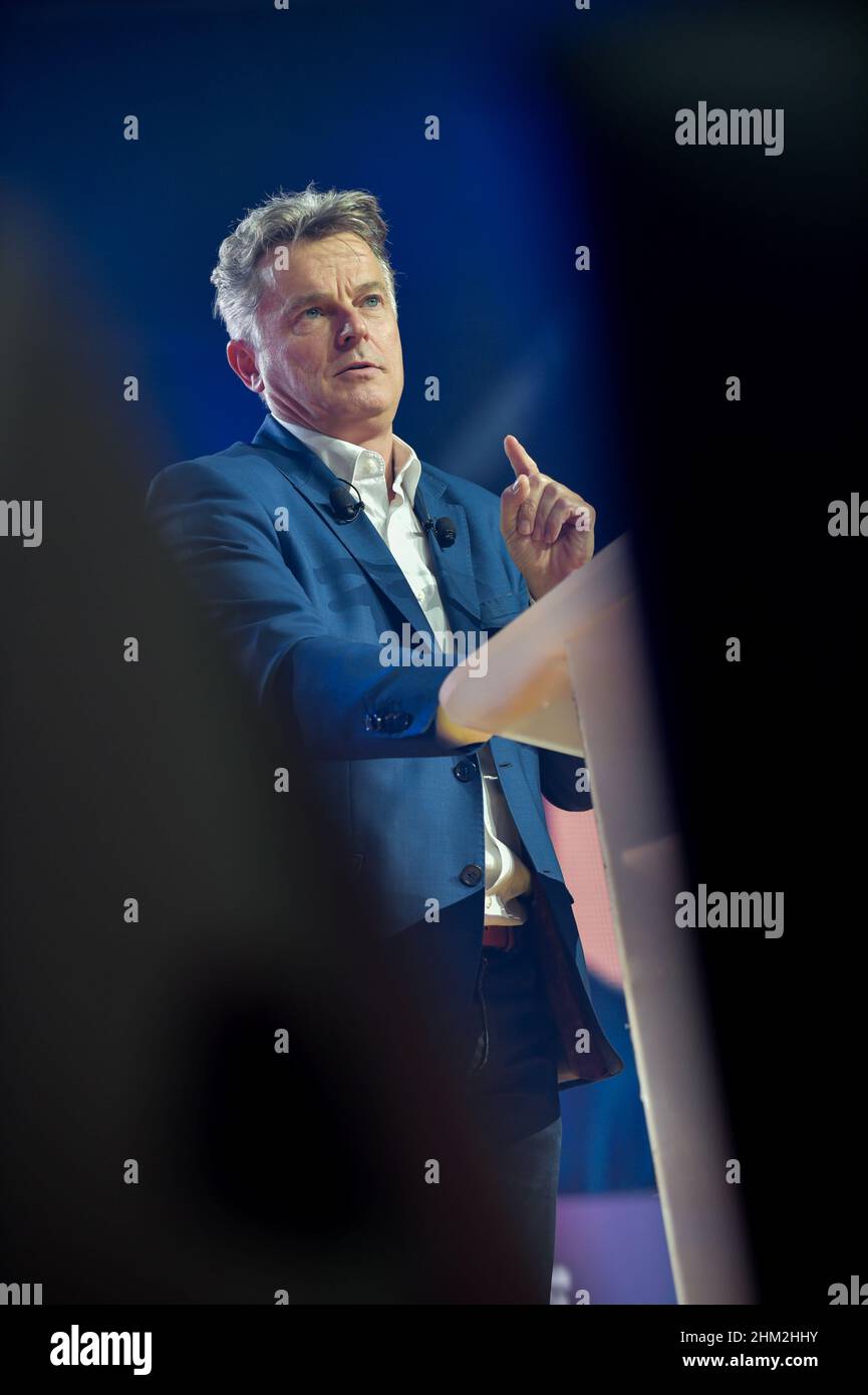 Fabien Roussel is seen on stage making his speech during his first ...
