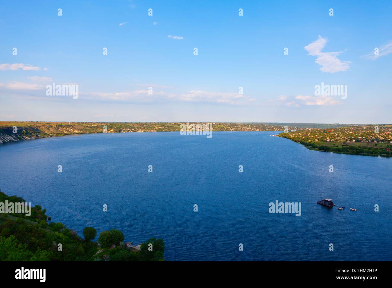 Large river flowing , view from above . Calm river water . Rustic ...