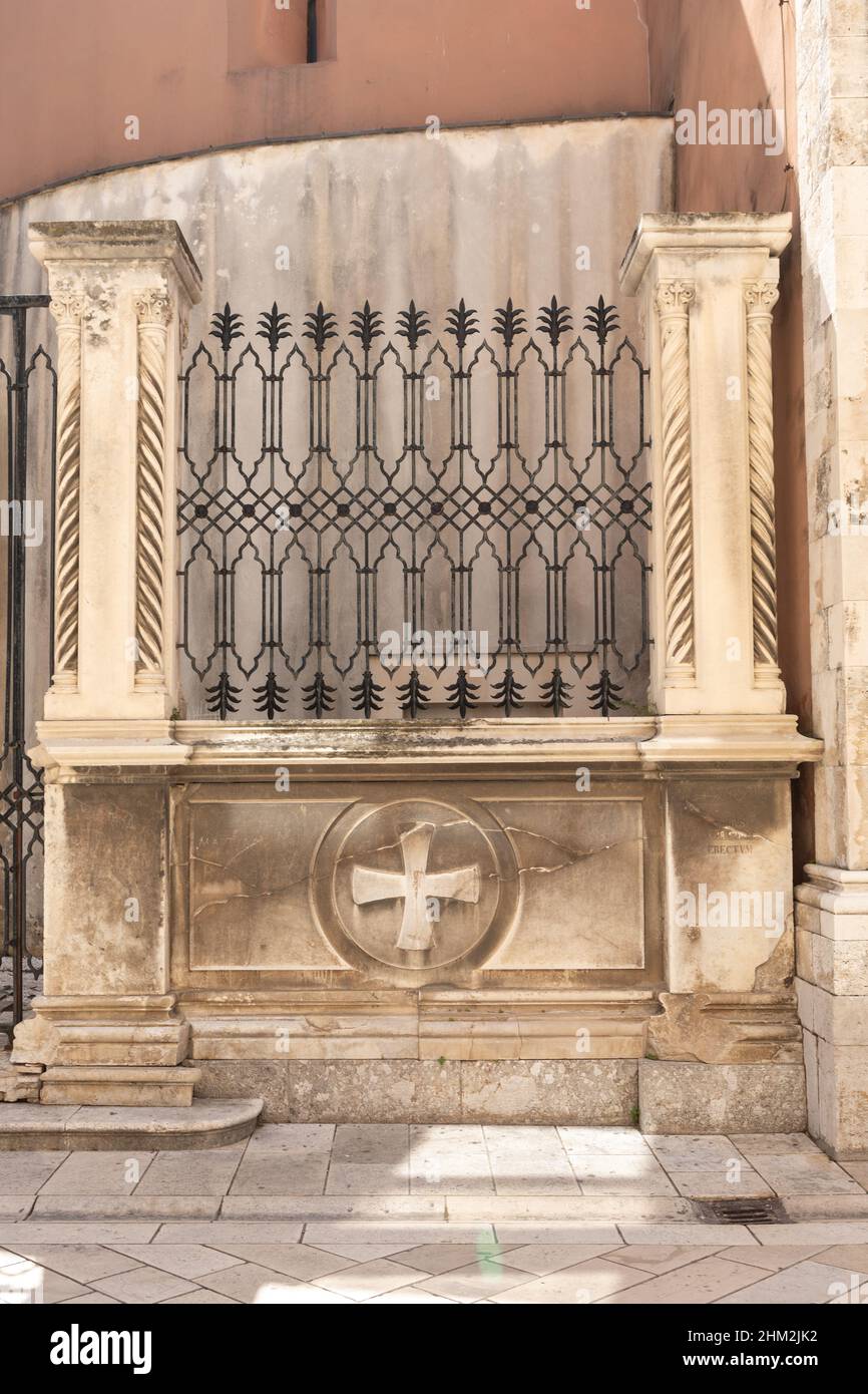 Zadar, Croatia - August 2021. part of the fence by ancient church wall ...