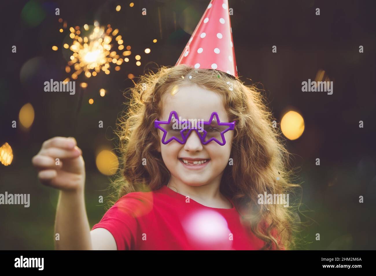 Girl in party hat hi-res stock photography and images - Alamy