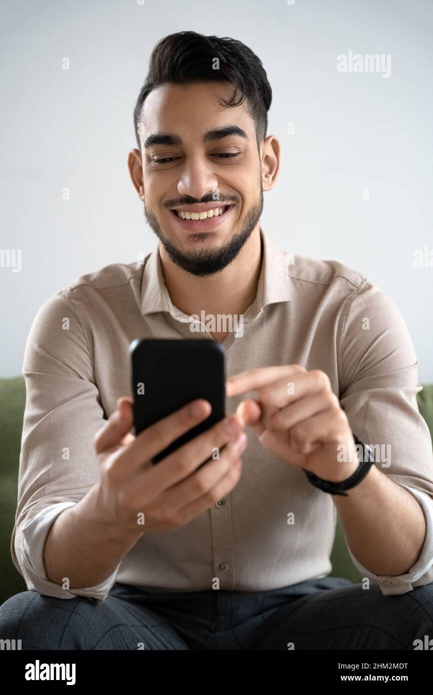Indian businessman browsing internet laughing hi-res stock photography ...