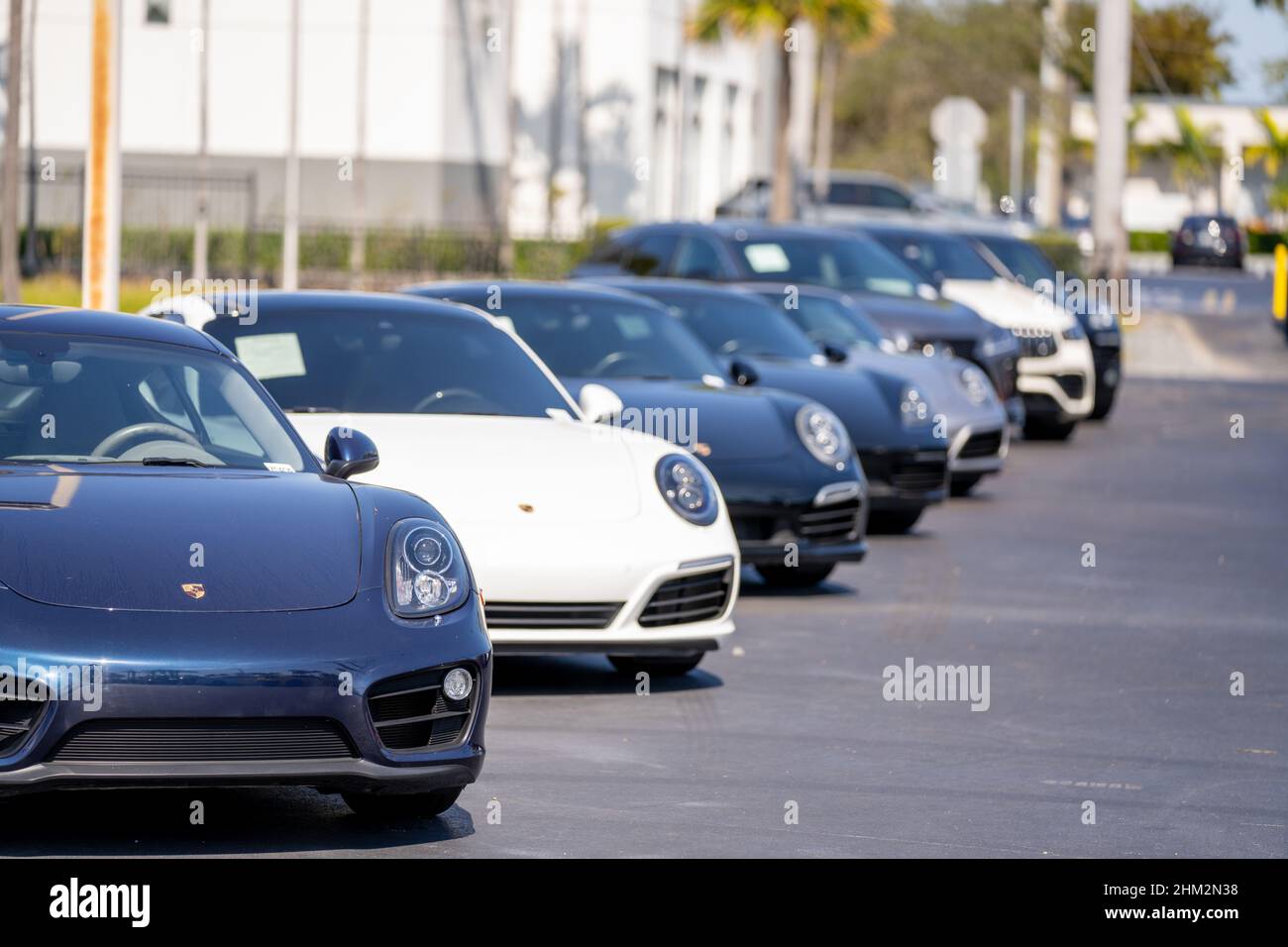 Miami, FL, USA - February 5, 2022: Photo of many new Porsche cars in a ...
